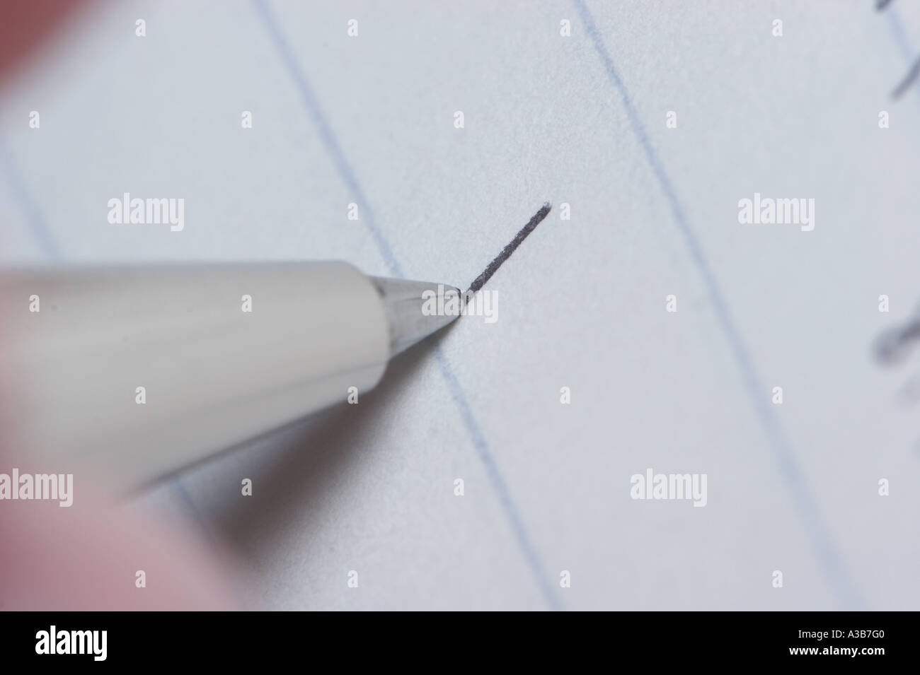 A person writing with an ink pen Stock Photo - Alamy