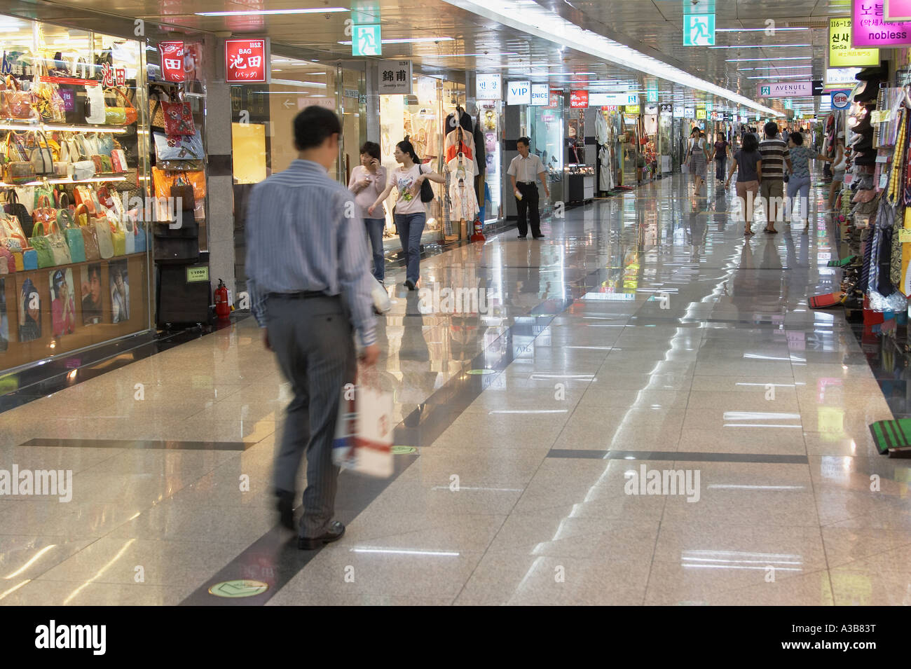 People Walking Through Underground Mall Stock Photo - Alamy