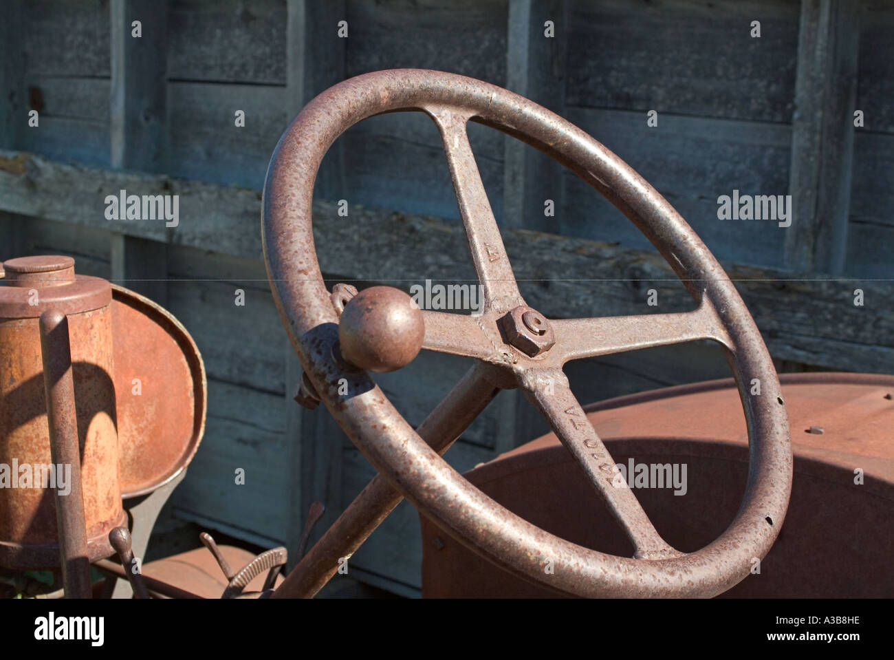Steel steering wheel on an old rusted tractor Stock Photo - Alamy