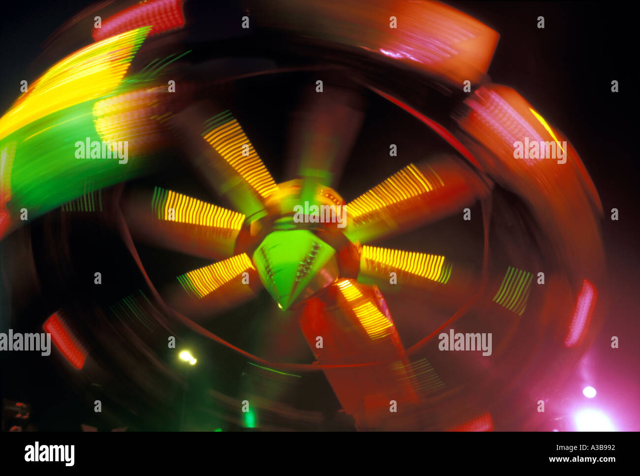 Spinning fairground wheel Stock Photo - Alamy