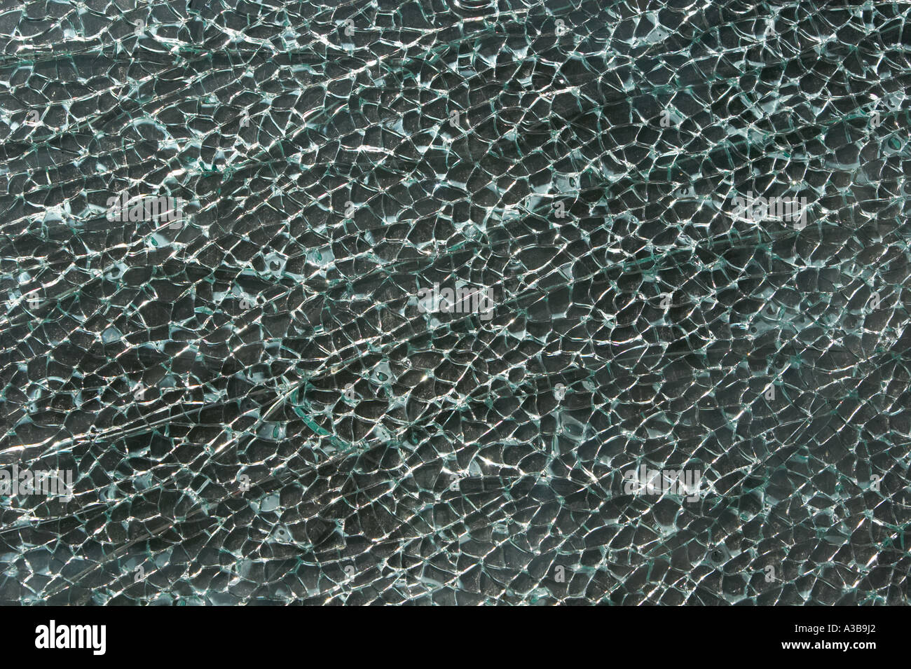 A shattered window with broken glass Stock Photo - Alamy