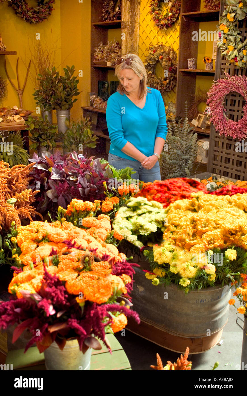 Woman in a flower shop at the Embarcadero Market San Francisco ...