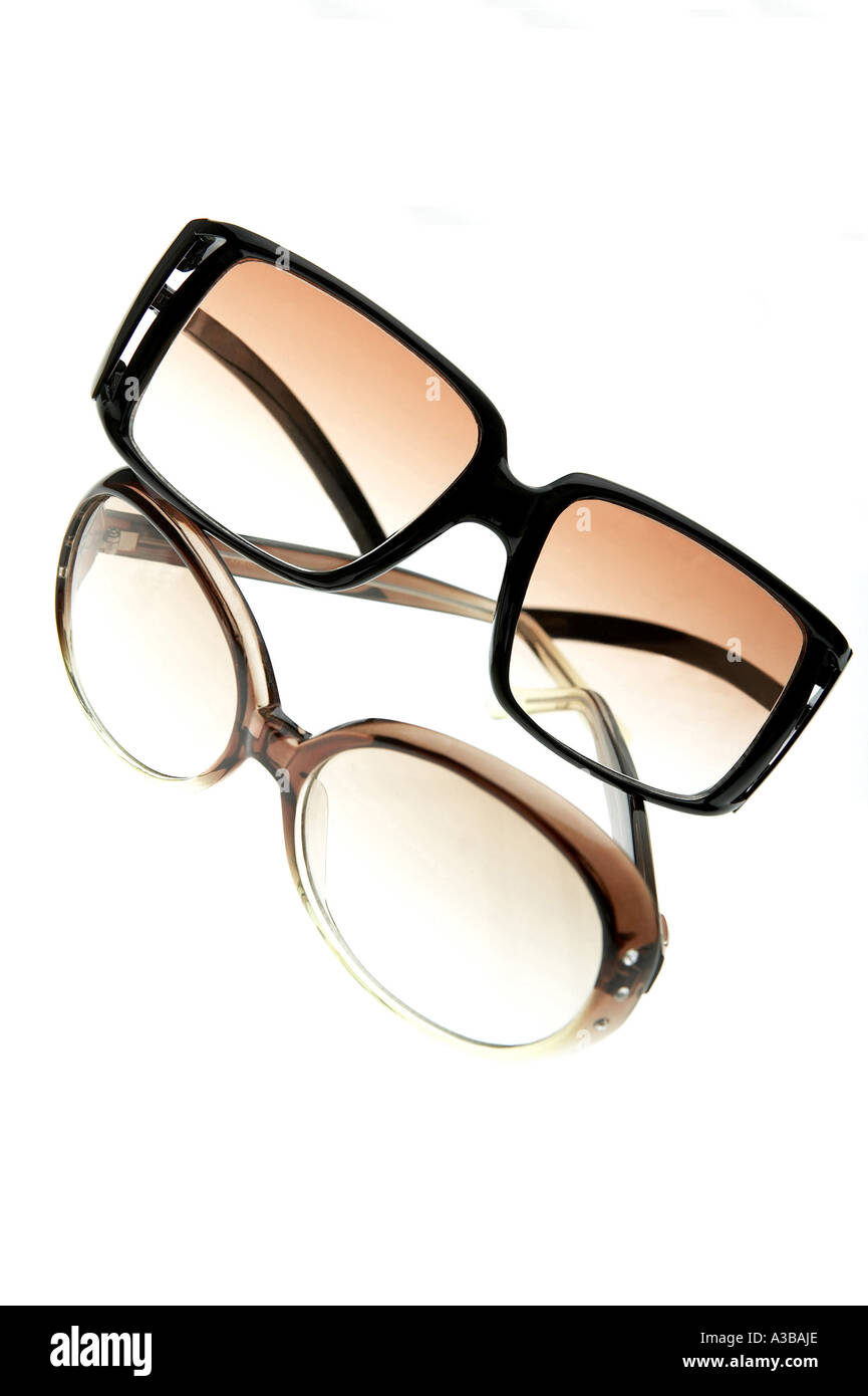 Two pairs of sunglasses in white background Stock Photo - Alamy