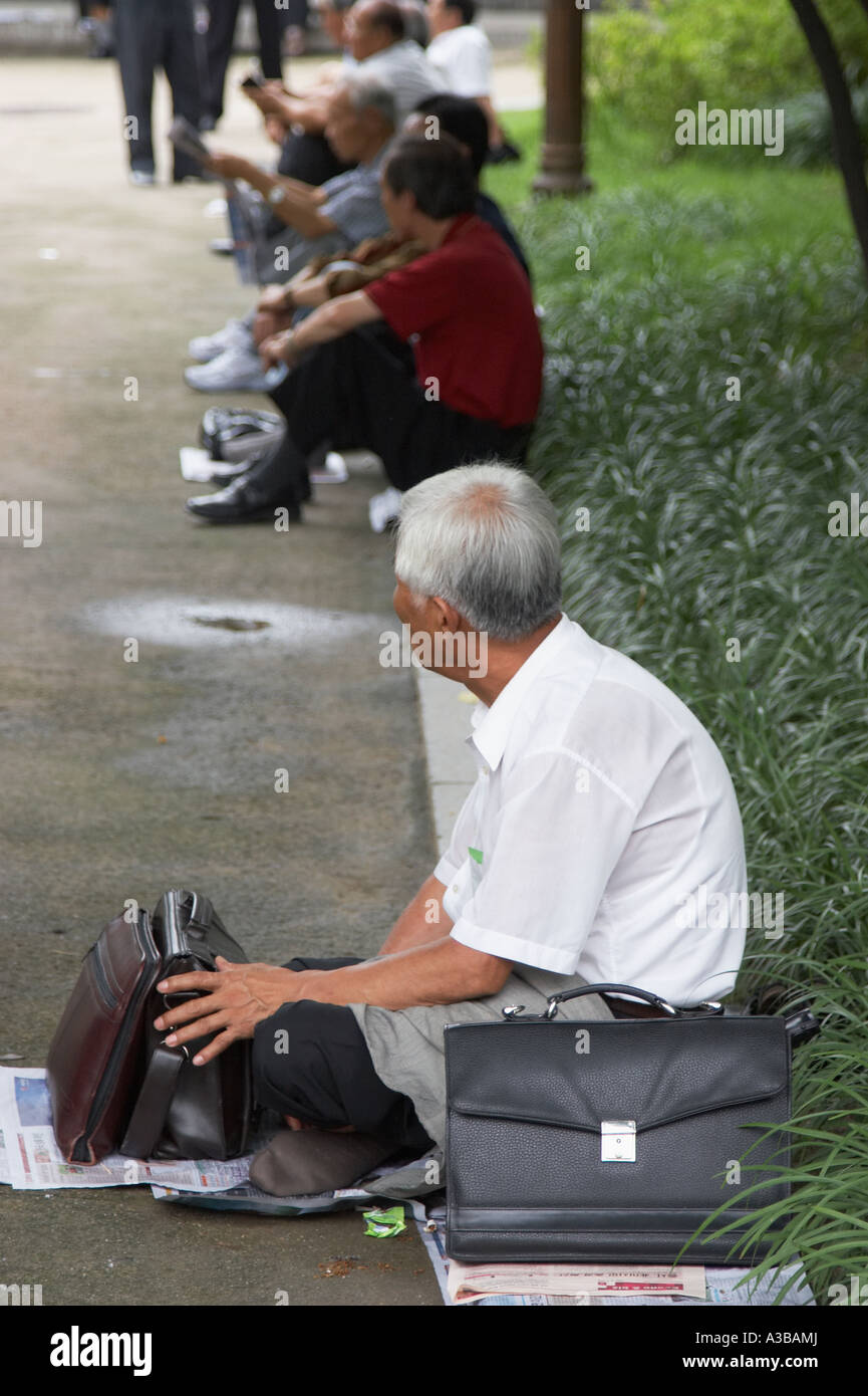 Male sitting seated on ground hi-res stock photography and images - Alamy