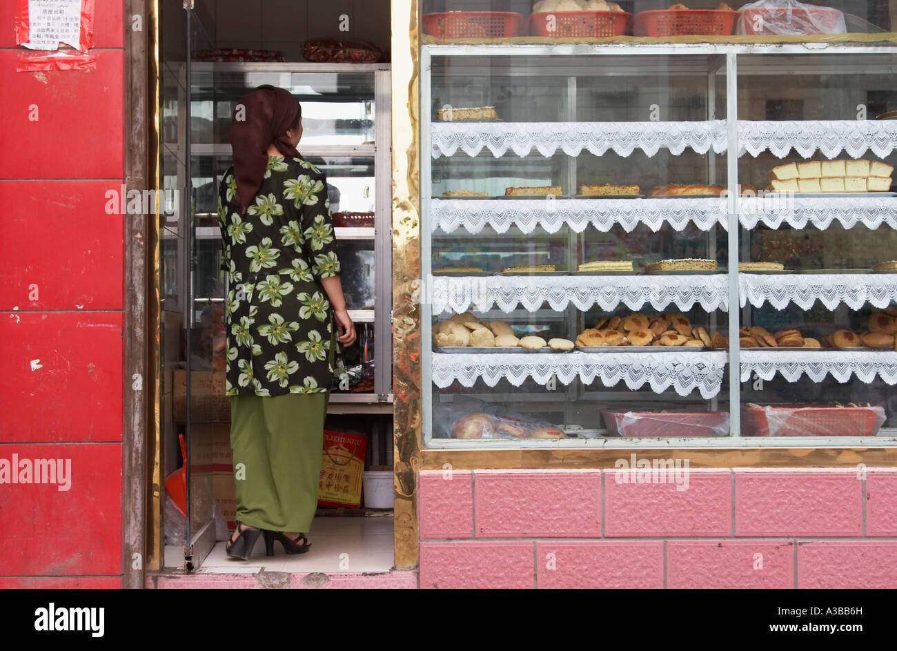 Woman Inside Cake Shop Stock Photo - Alamy