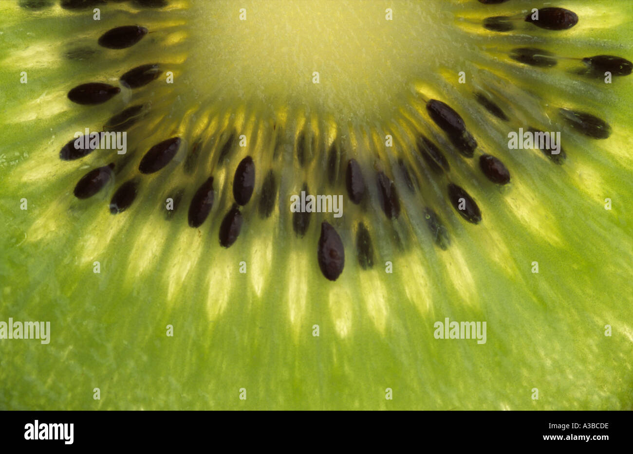 Detail of cut Passion fruit showing radiating seeds Stock Photo - Alamy