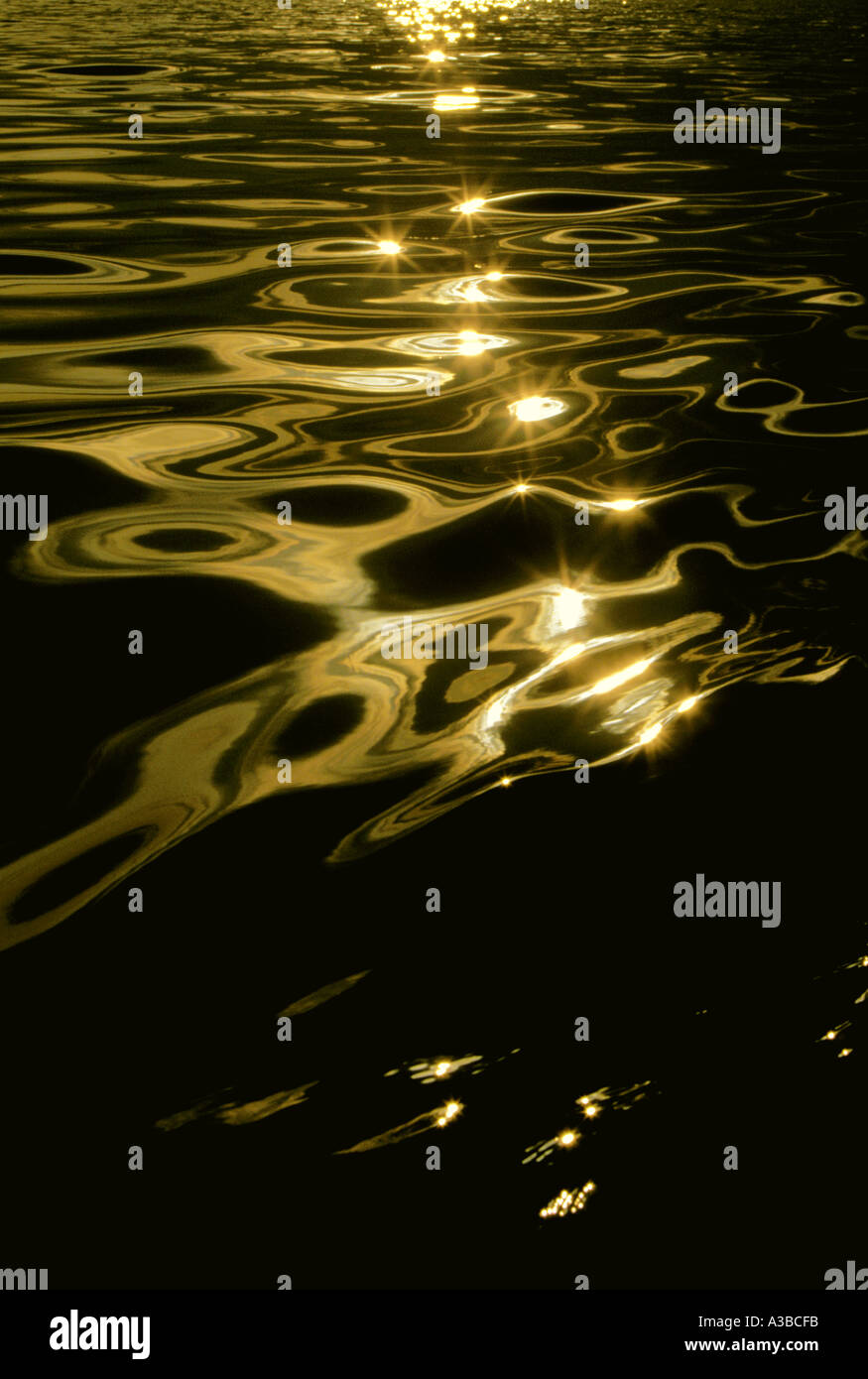 Sunlight tinted water Stock Photo - Alamy