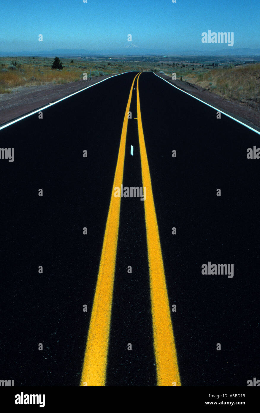Highway with yellow striping to indicate no passing or crossing into ...