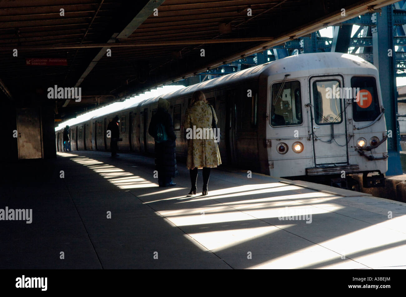 An F train pulls into the Smith Ninth Street Station in the NYC transit ...