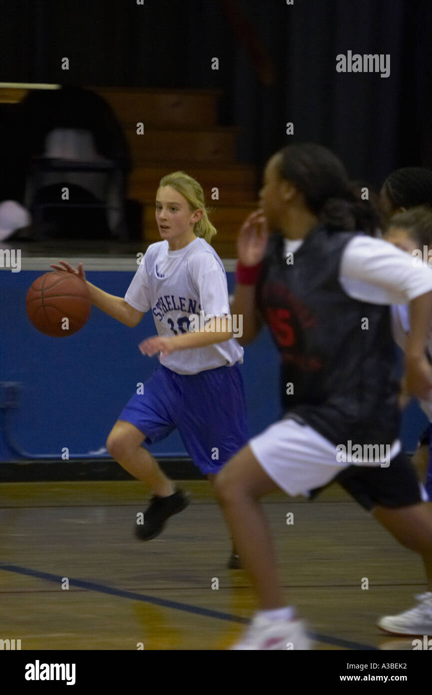 A girl running down the basketball court Stock Photo - Alamy