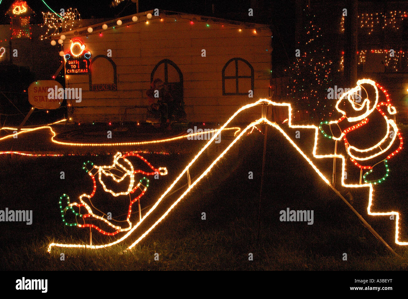 christmas lights with two santa figures playing on a slide Stock Photo ...