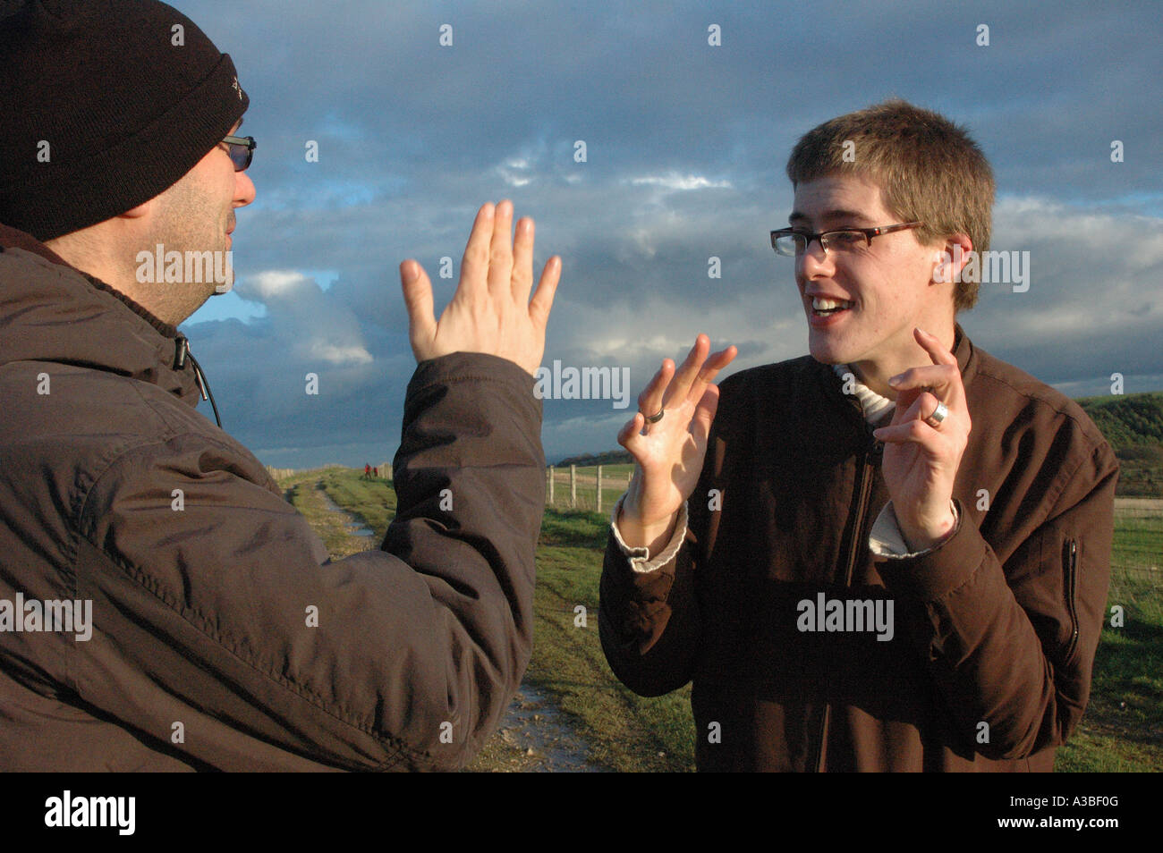 Two men having a conversation in British sign language in the ...