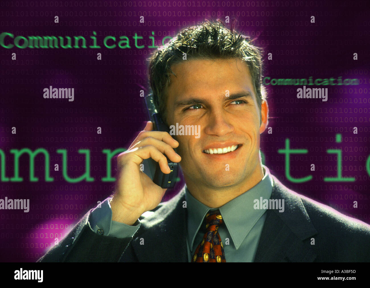 Communication Attractive young man talking on cell phone Stock Photo ...