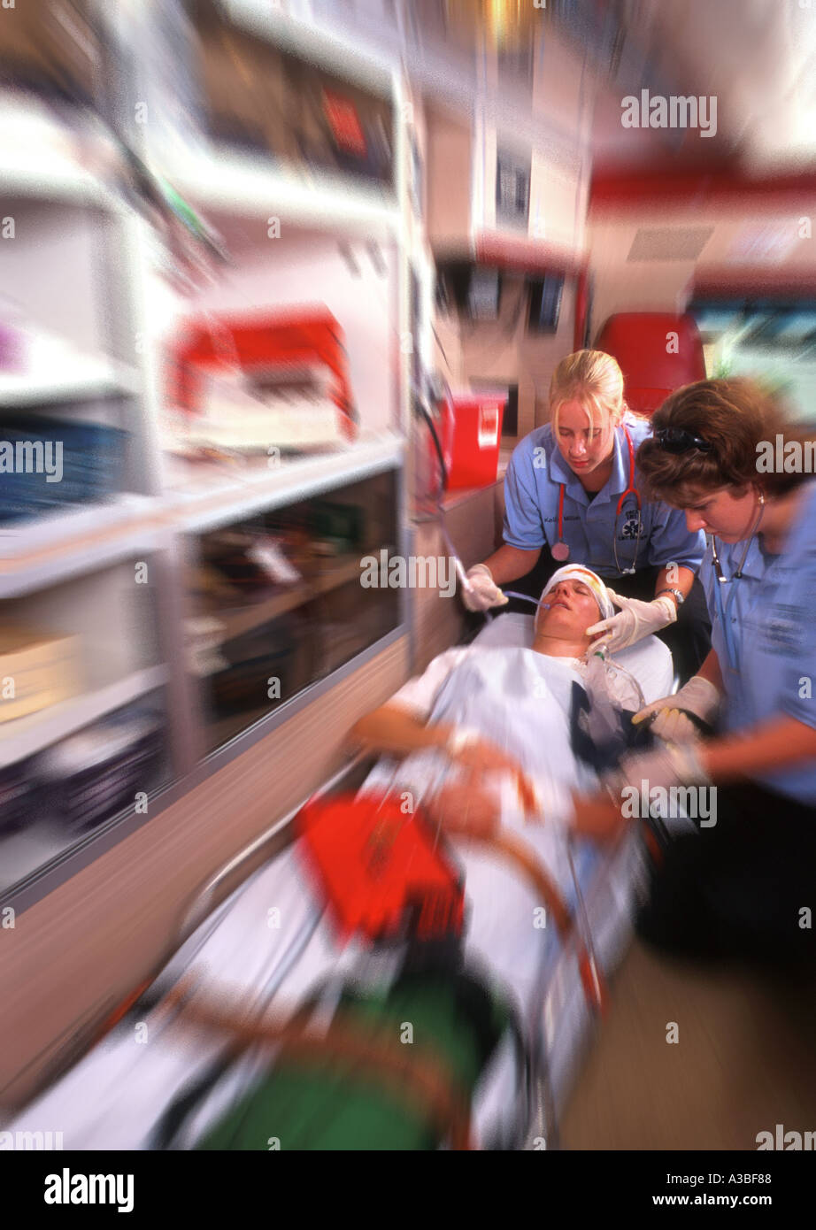 Emergency Female paramedics working on patient in ambulance Stock Photo ...
