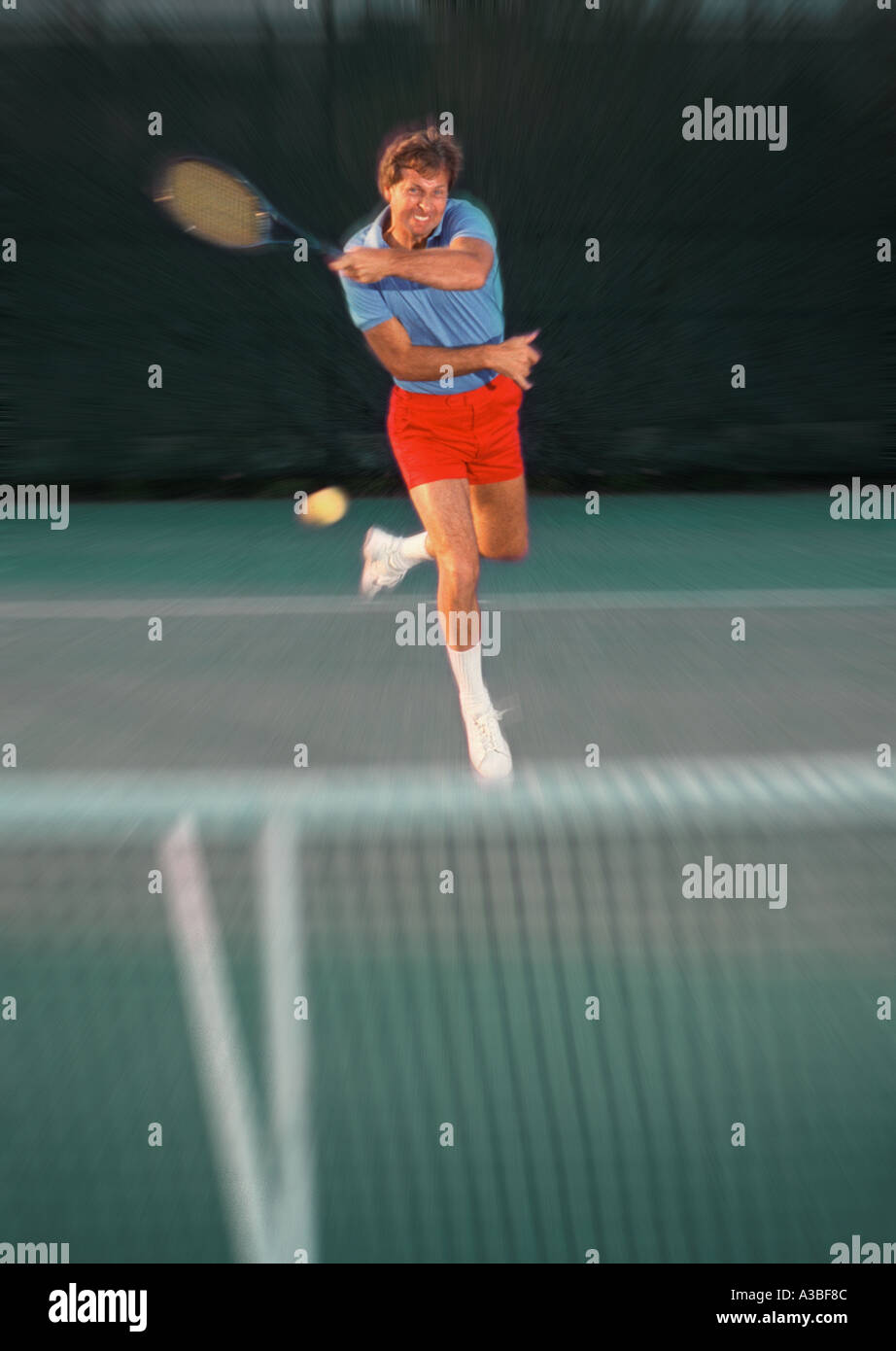 Action Man hitting tennis ball Stock Photo - Alamy