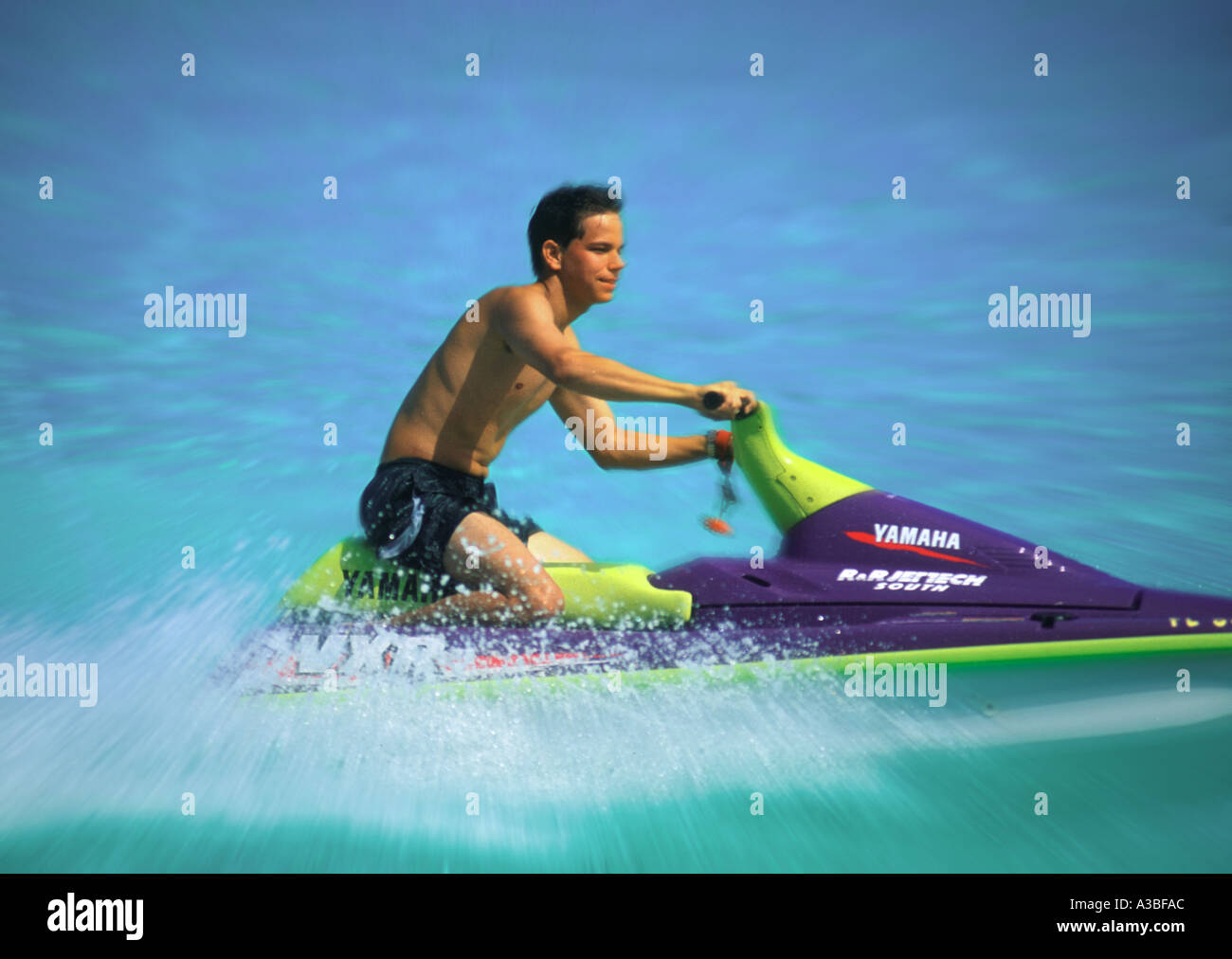 Action Man riding jet ski Stock Photo - Alamy
