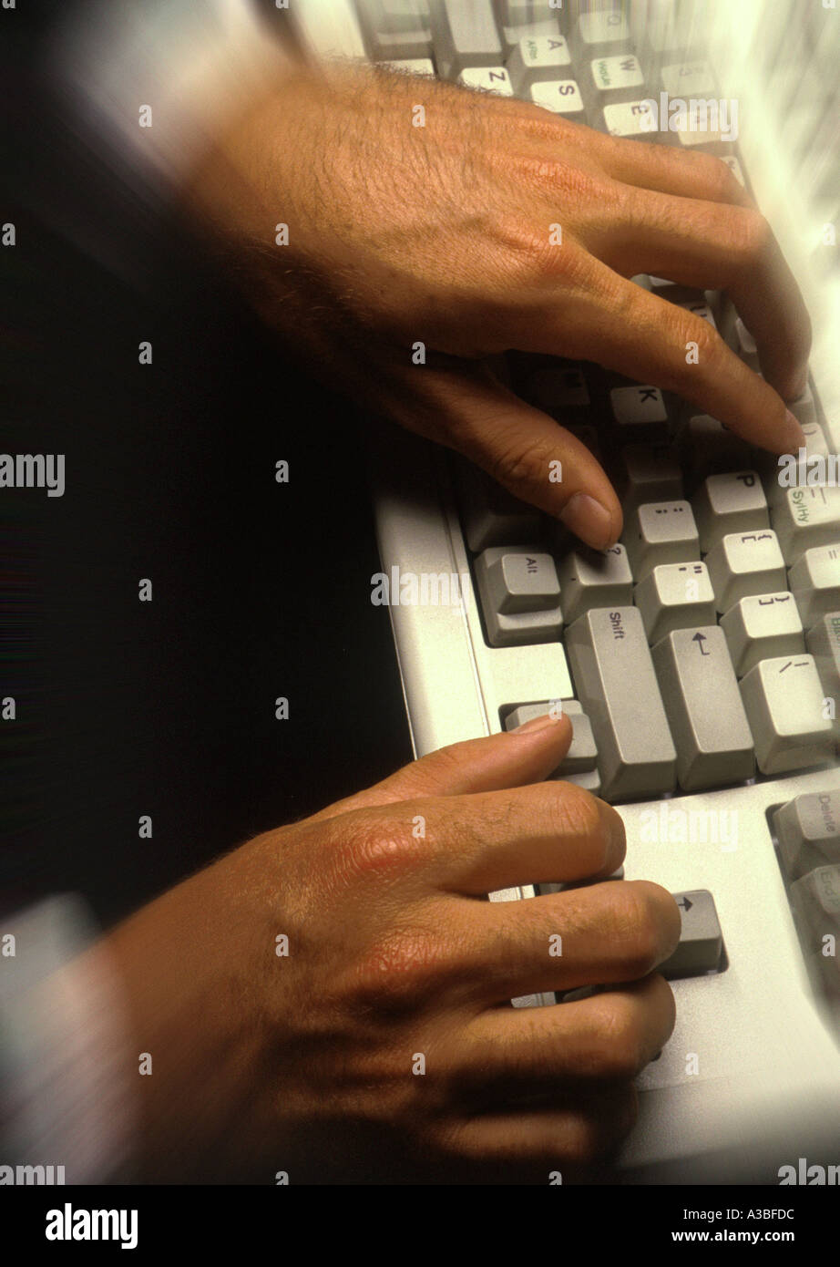Abstract Hands on keyboard Stock Photo - Alamy