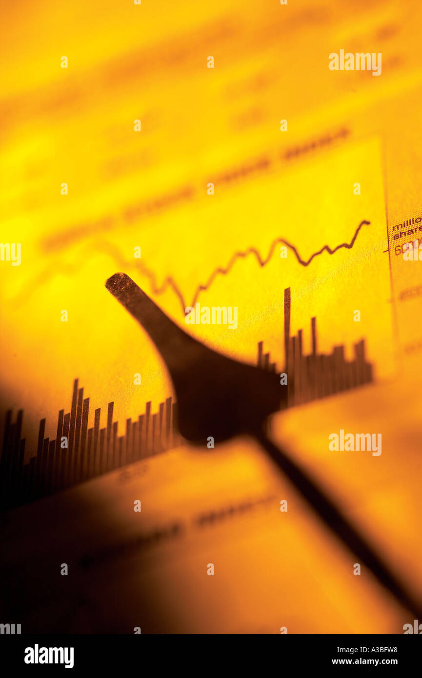 the hand of clock pointing a graph Stock Photo - Alamy