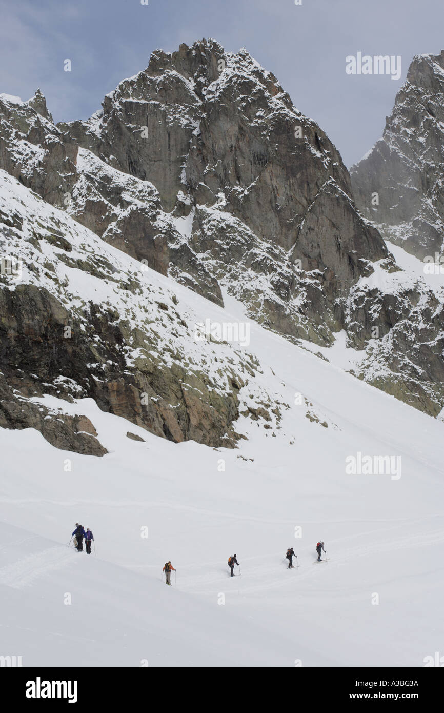 Climbers traversing track in snow Skiers mountain Stock Photo - Alamy