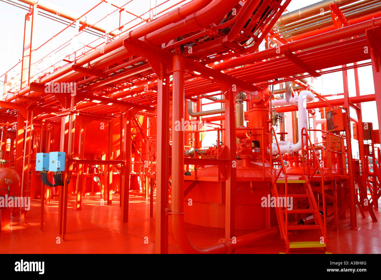 Bright red gas tank and pipes Stock Photo - Alamy