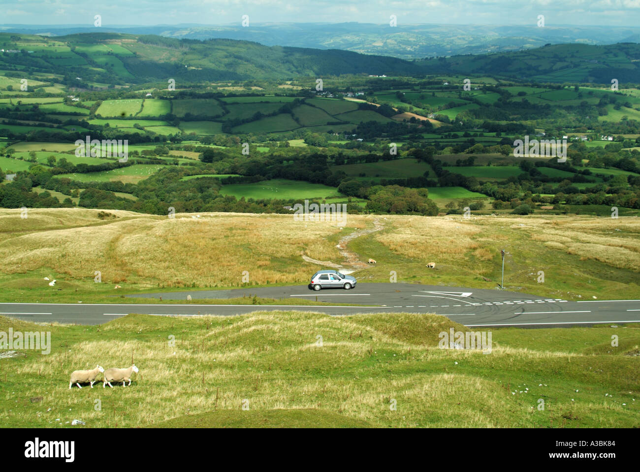 Brecon Beacons National Park quiet unfenced road with lone car at ...