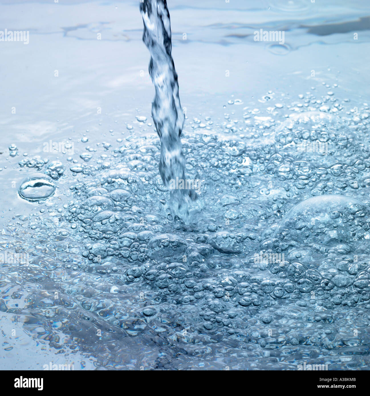 water poured in the flowing water Stock Photo - Alamy