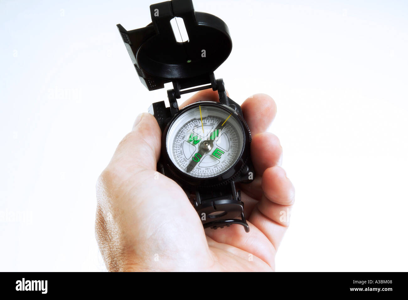 Hand holding compass, close-up Stock Photo - Alamy