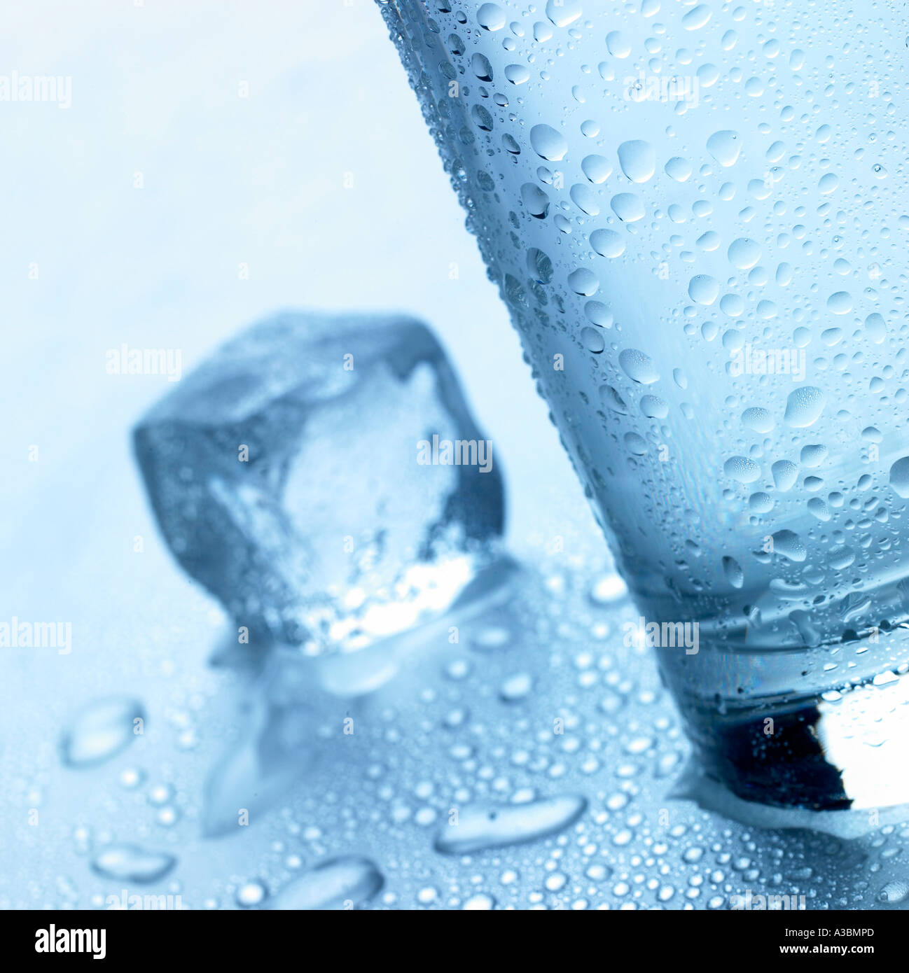 a watery glass and an ice cube Stock Photo - Alamy