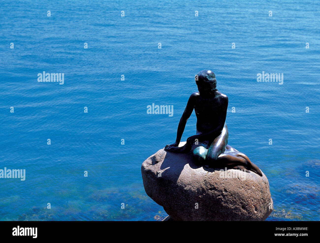 A statue on a rock with blue ocean in Denmark Stock Photo - Alamy