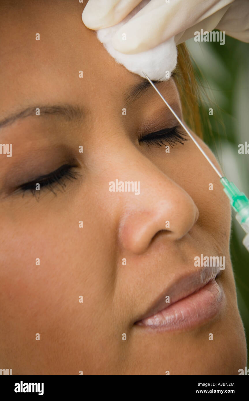 Chinese woman receiving botox injection hi-res stock photography and ...