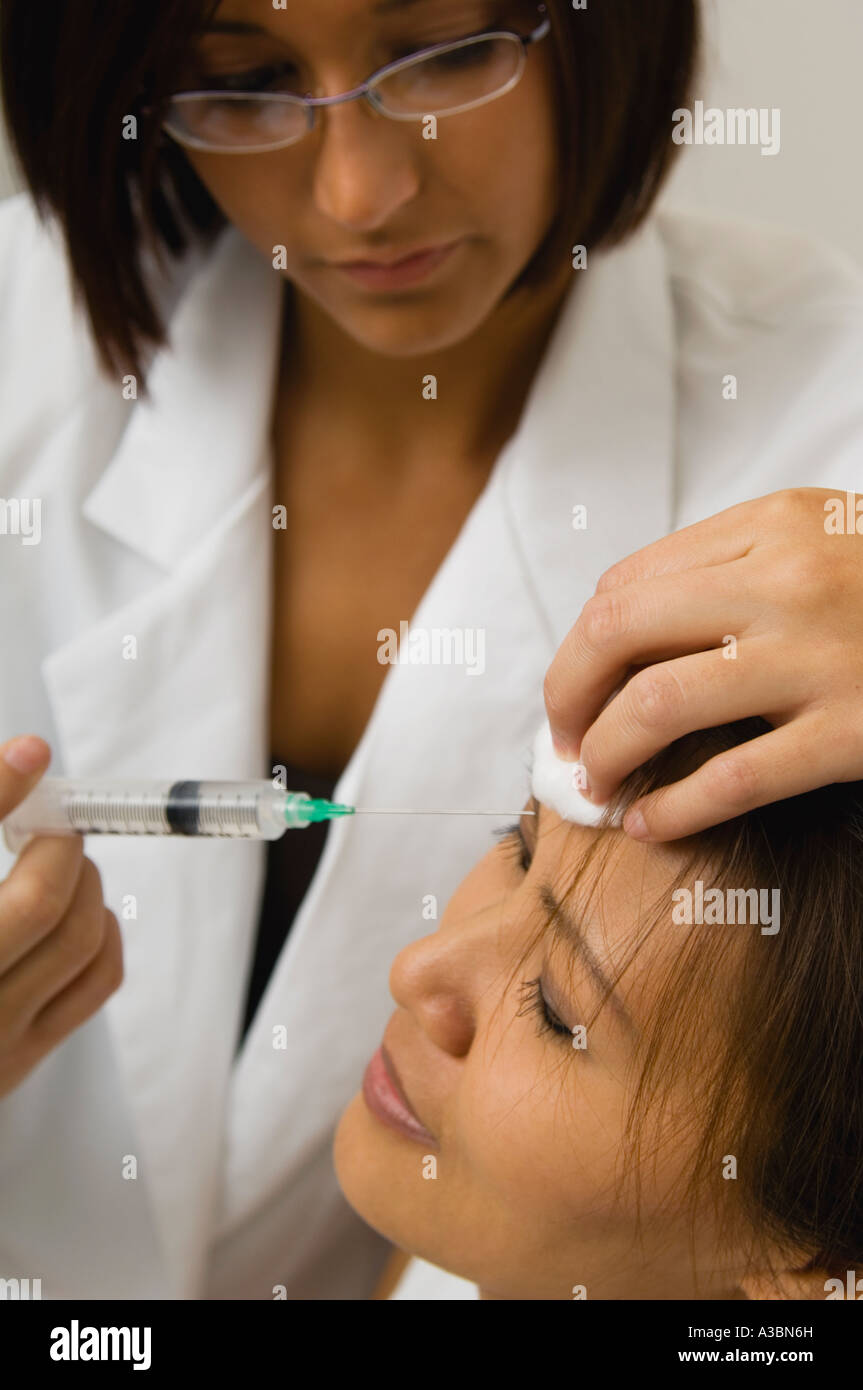 Chinese woman receiving botox injection hi-res stock photography and ...