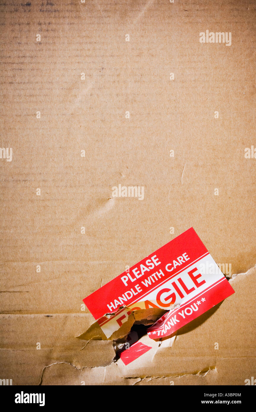 Fragile sticker on shipping box Stock Photo - Alamy