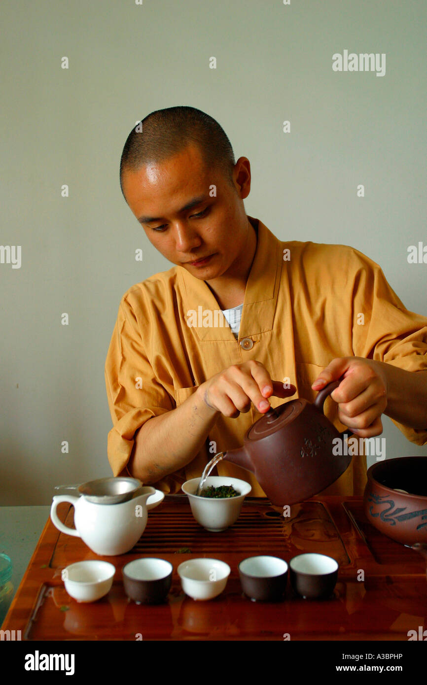 Chinese monk serving tea Stock Photo - Alamy