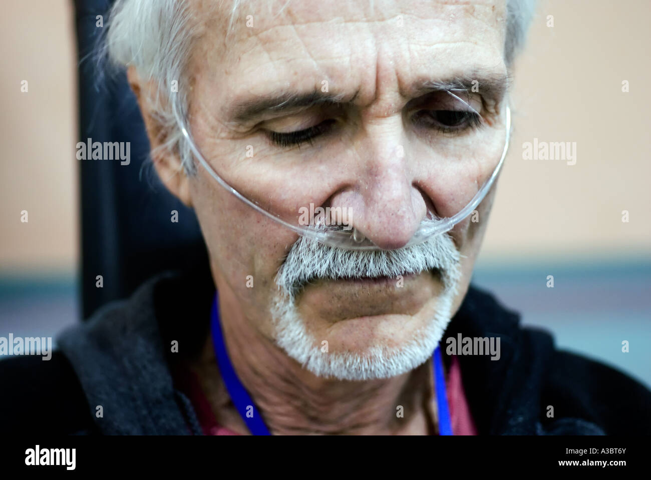 Elderly Man suffering from lung disease wears an oxygen mask as he ...