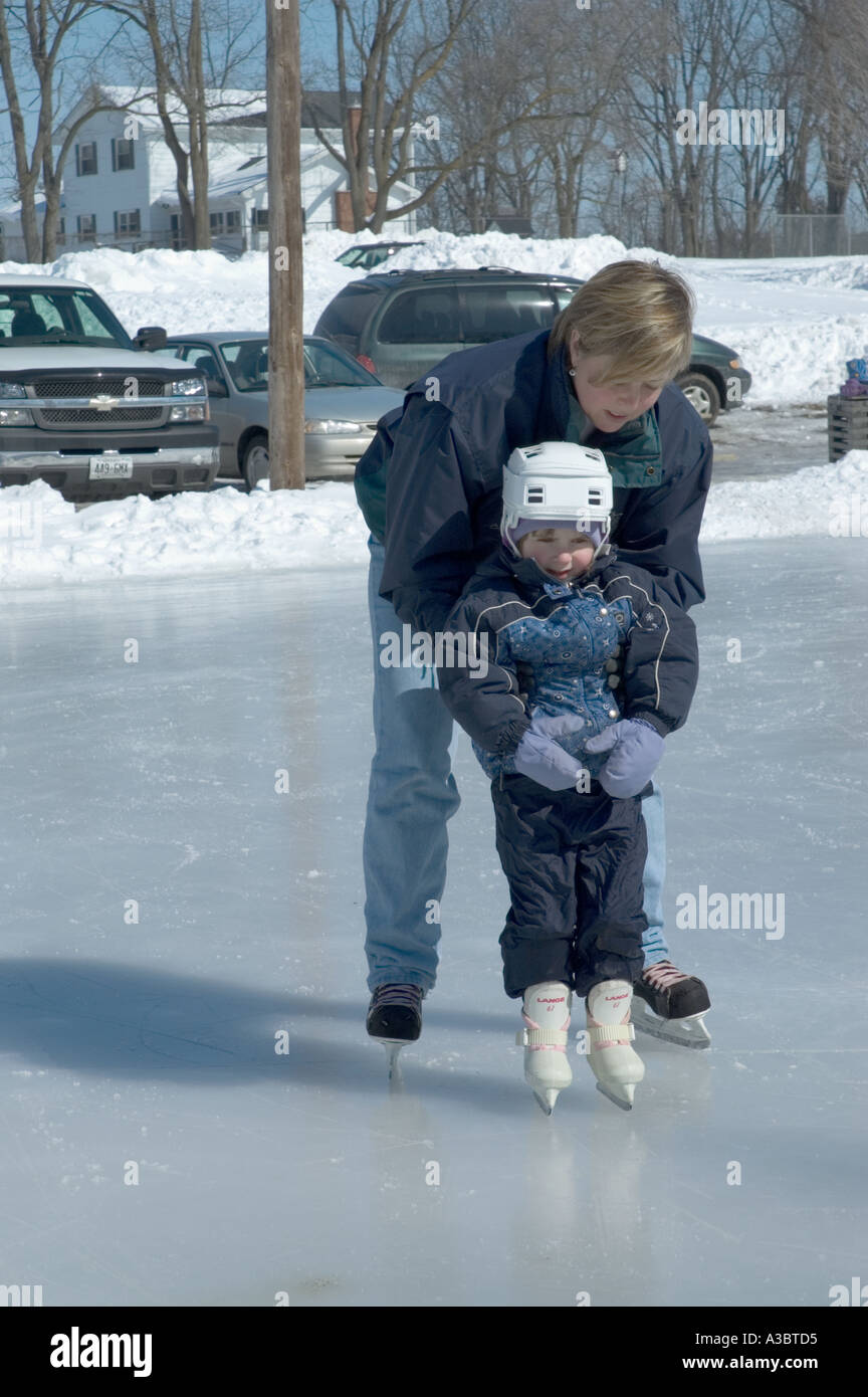 Learning to ice skate Stock Photo - Alamy