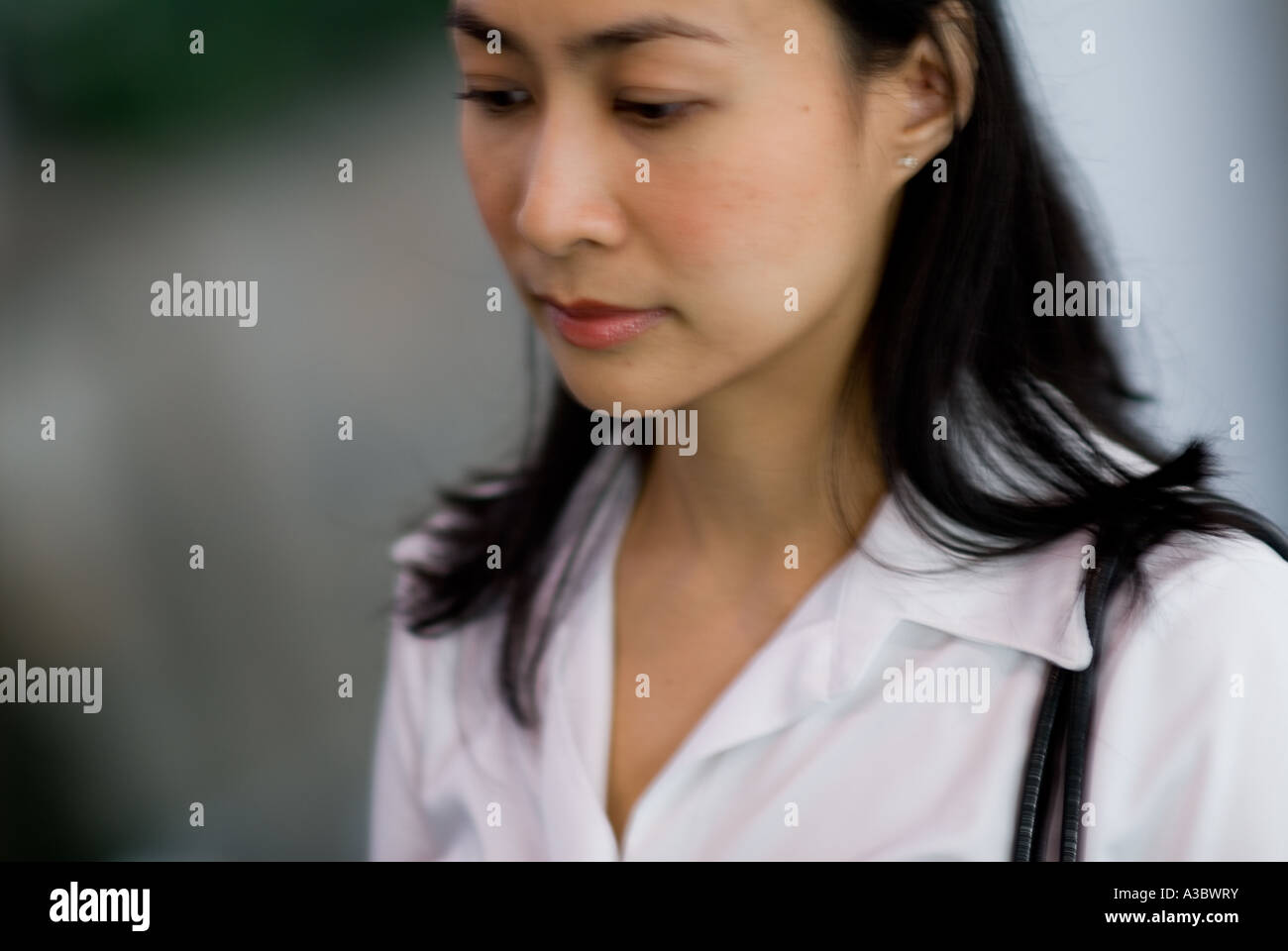 Young Thai businesswoman takes a lunchtime stroll Stock Photo - Alamy
