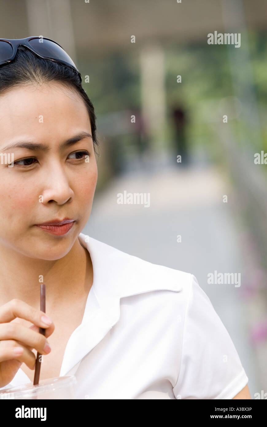 Young Thai businesswoman takes a lunchtime stroll Stock Photo - Alamy