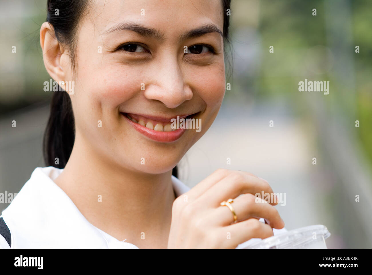 Young Thai businesswoman takes a lunchtime stroll Stock Photo - Alamy