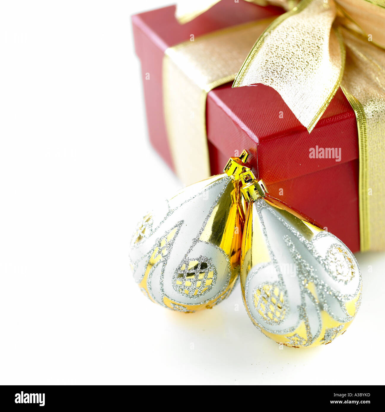 two christmas bells and a present Stock Photo - Alamy