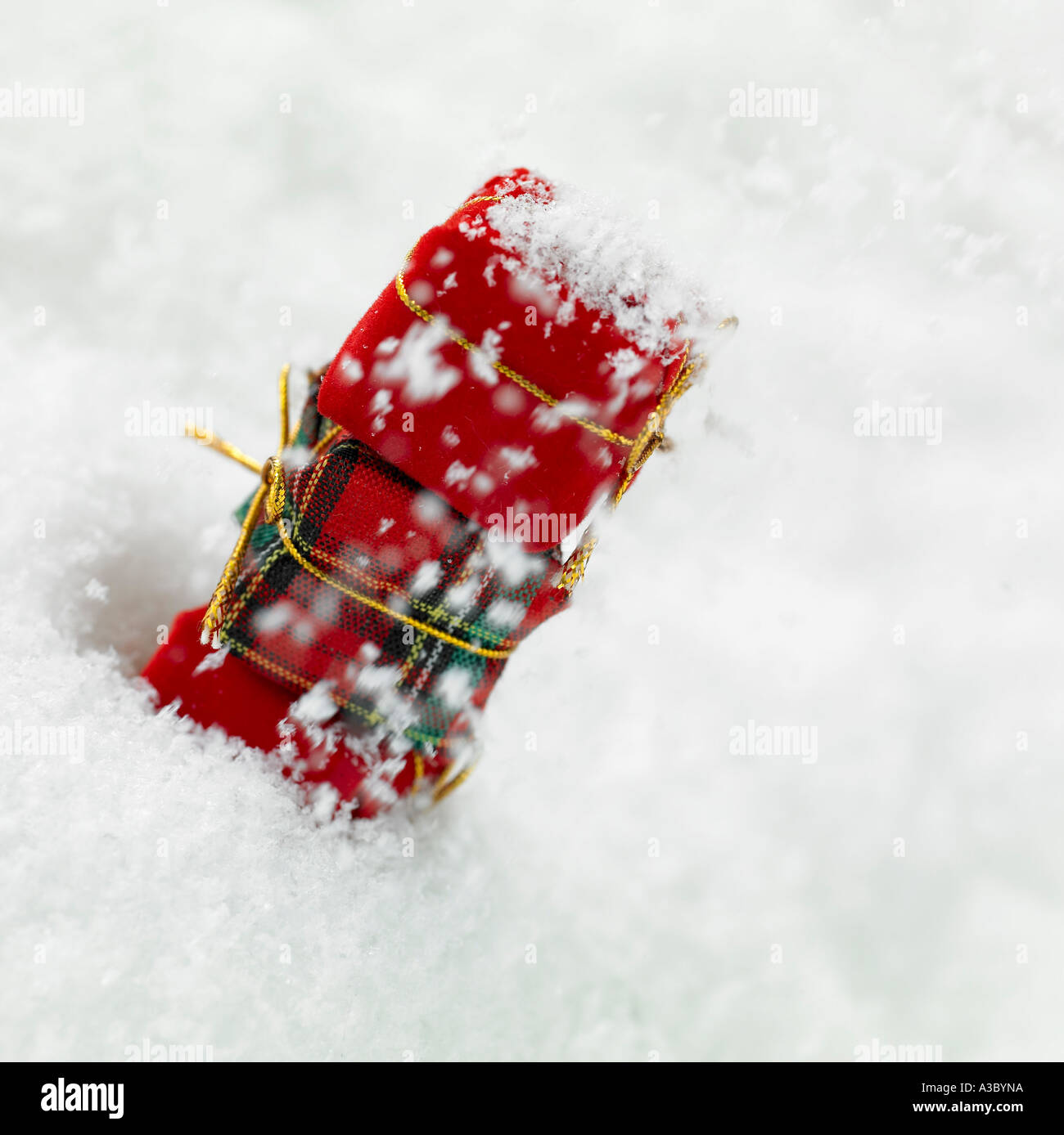 a pile of presents in snow Stock Photo - Alamy