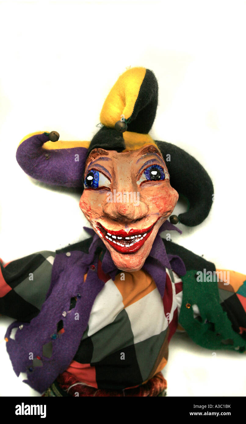 A joker or Mister Punch puppet on white background Stock Photo - Alamy