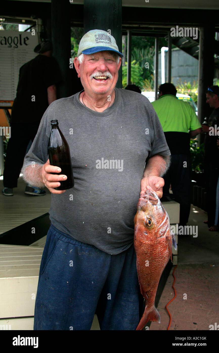 Bob Whitmore of Great Barrier Island New Zealand with beer and snapper ...