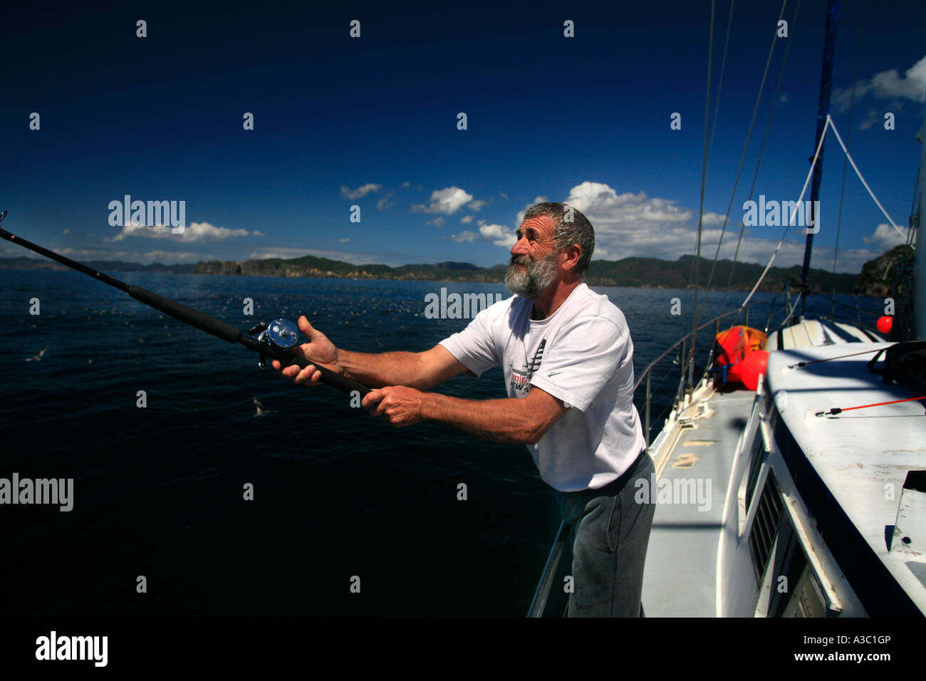 Bob Benseman casts a line off his yacht Chieftain at Square rock near ...
