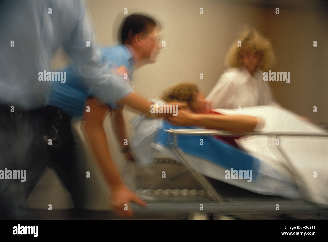 Blurred image of paramedic nurse rushing patient into hospital ...