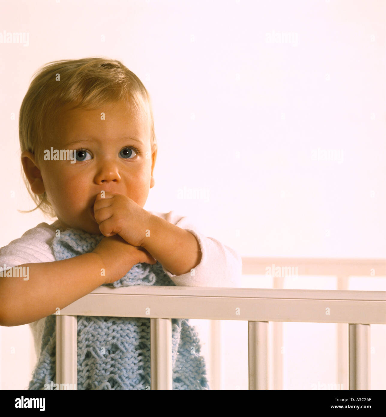 Baby standing in crib scared hi-res stock photography and images - Alamy
