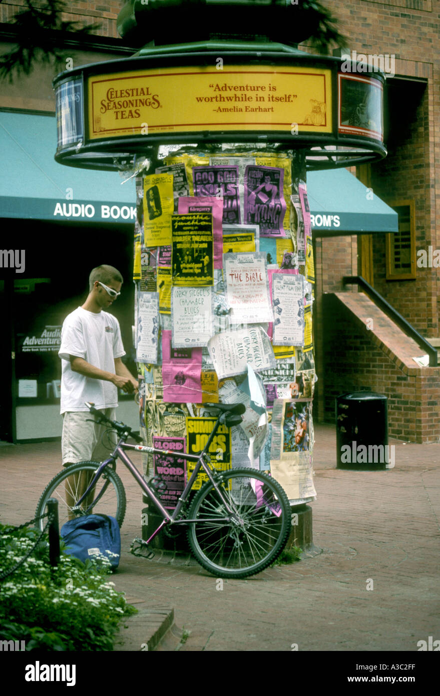 Street stand man reading posters news Stock Photo - Alamy
