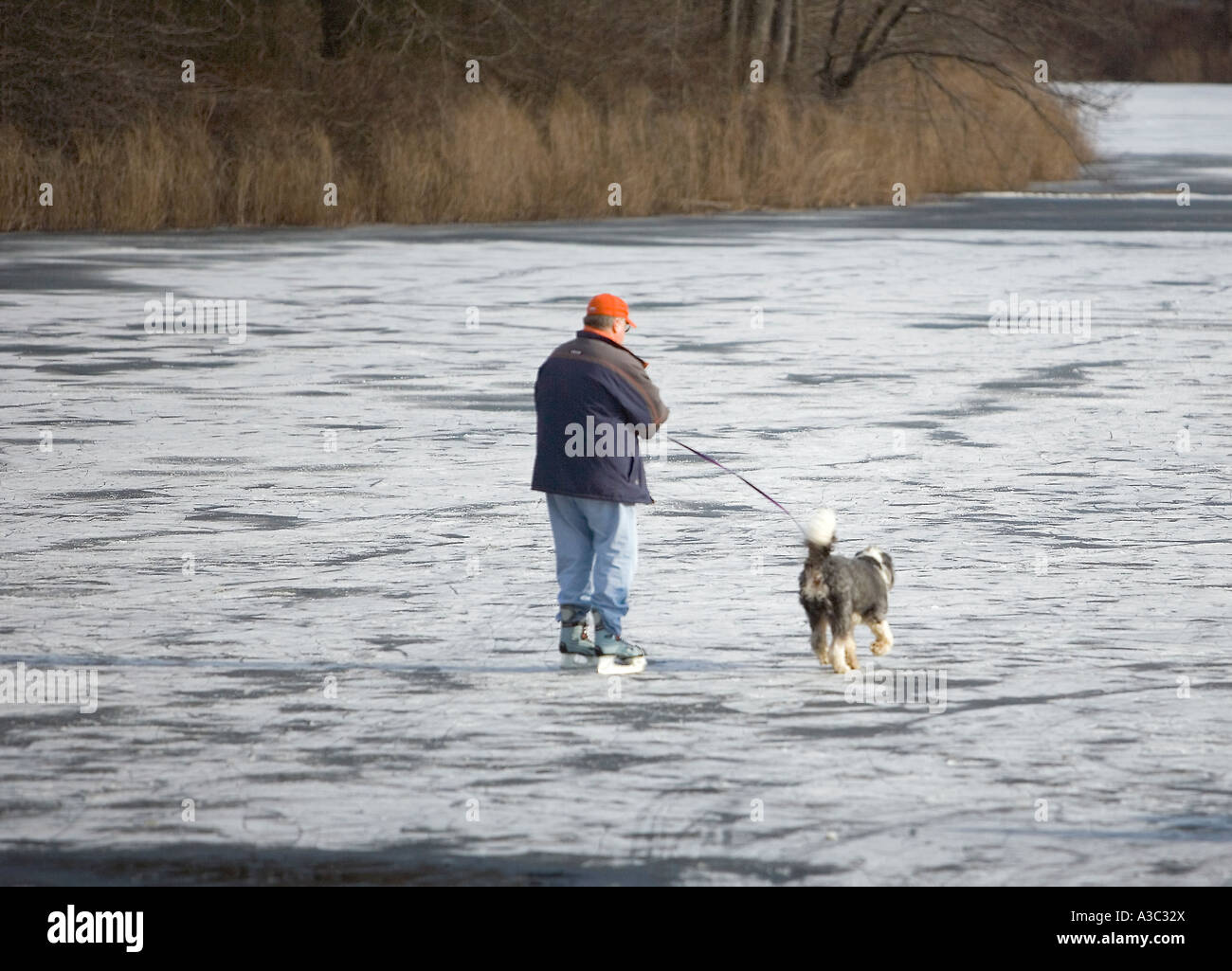 People walking on a frozen lake Stock Photo - Alamy