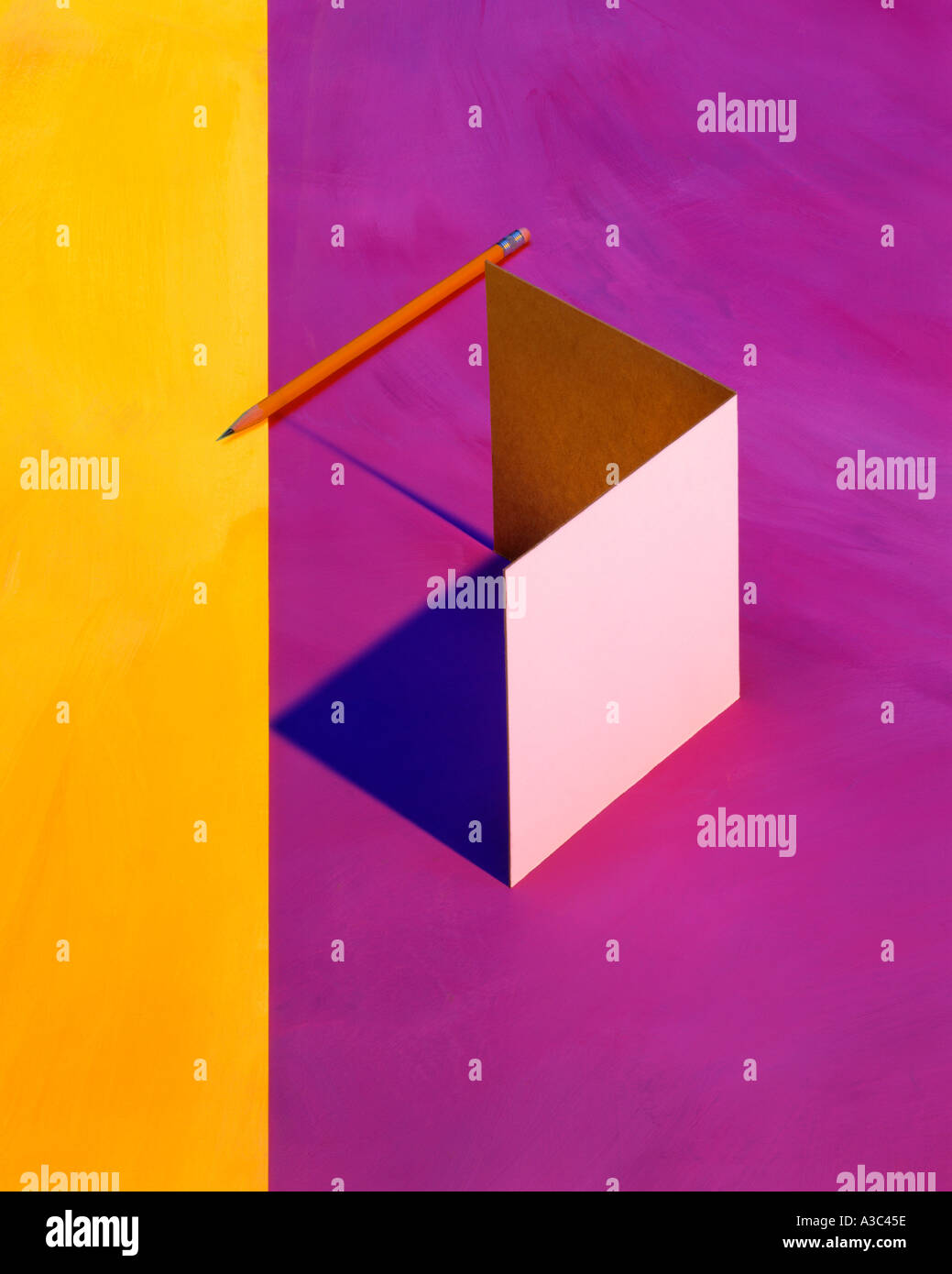 Optical illusion of a cube created by placing paper pencil and shadow ...