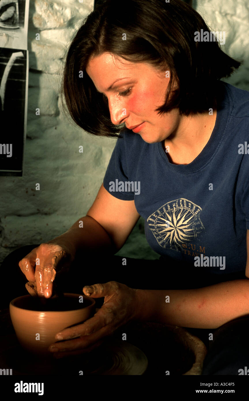 young woman potter throwing a pot Stock Photo - Alamy