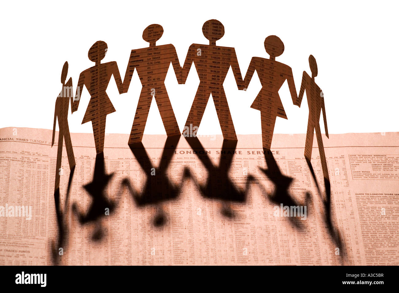 Financial Times Paper men and women cut outs in pink Stock Photo - Alamy